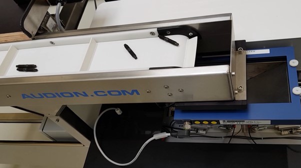 Optimizer with conveyor system | Audion Elektro