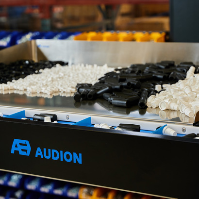 Optimizer with conveyor system | Audion Elektro